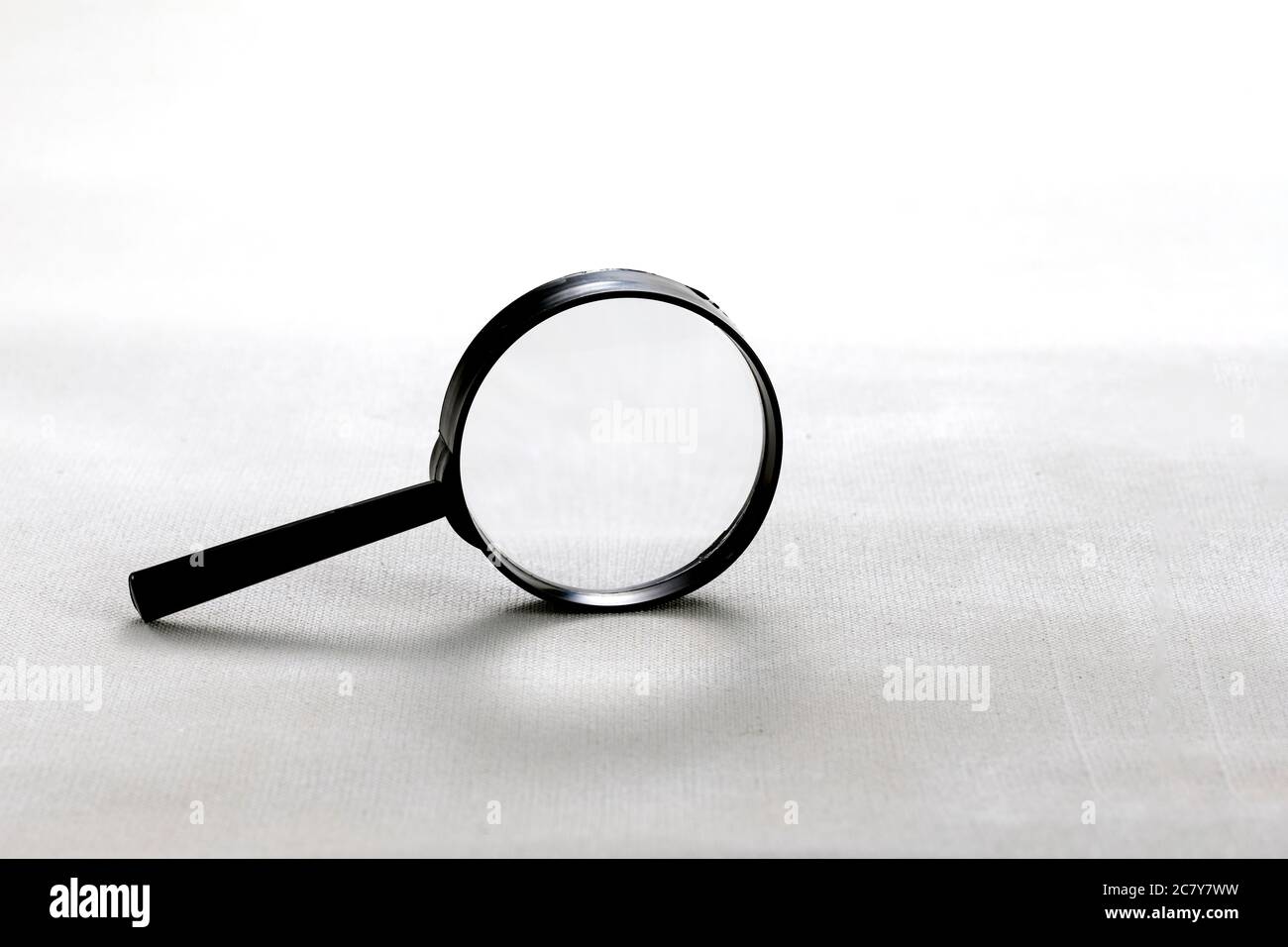 Magnifier glass with shadow isolated on white background. Front view ...