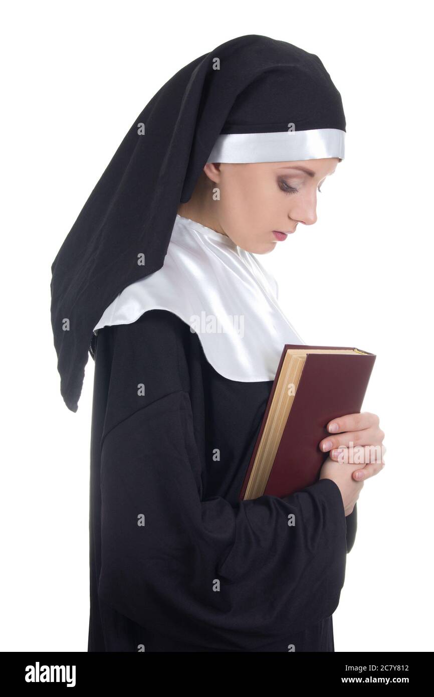 young beautiful woman nun praying with bible isolated on white ...