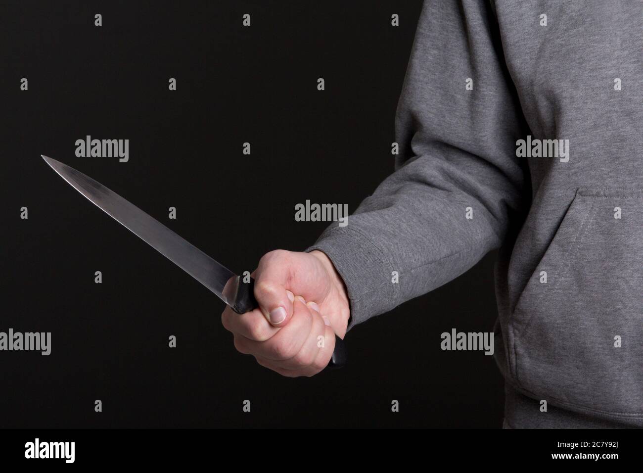 close up of knife in male hand over grey background Stock Photo - Alamy