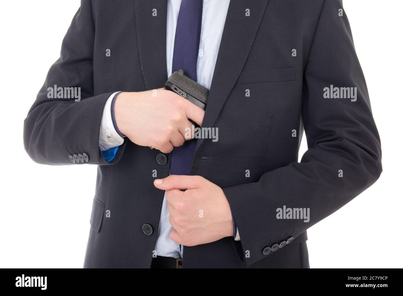 man hiding gun isolated on white background Stock Photo - Alamy