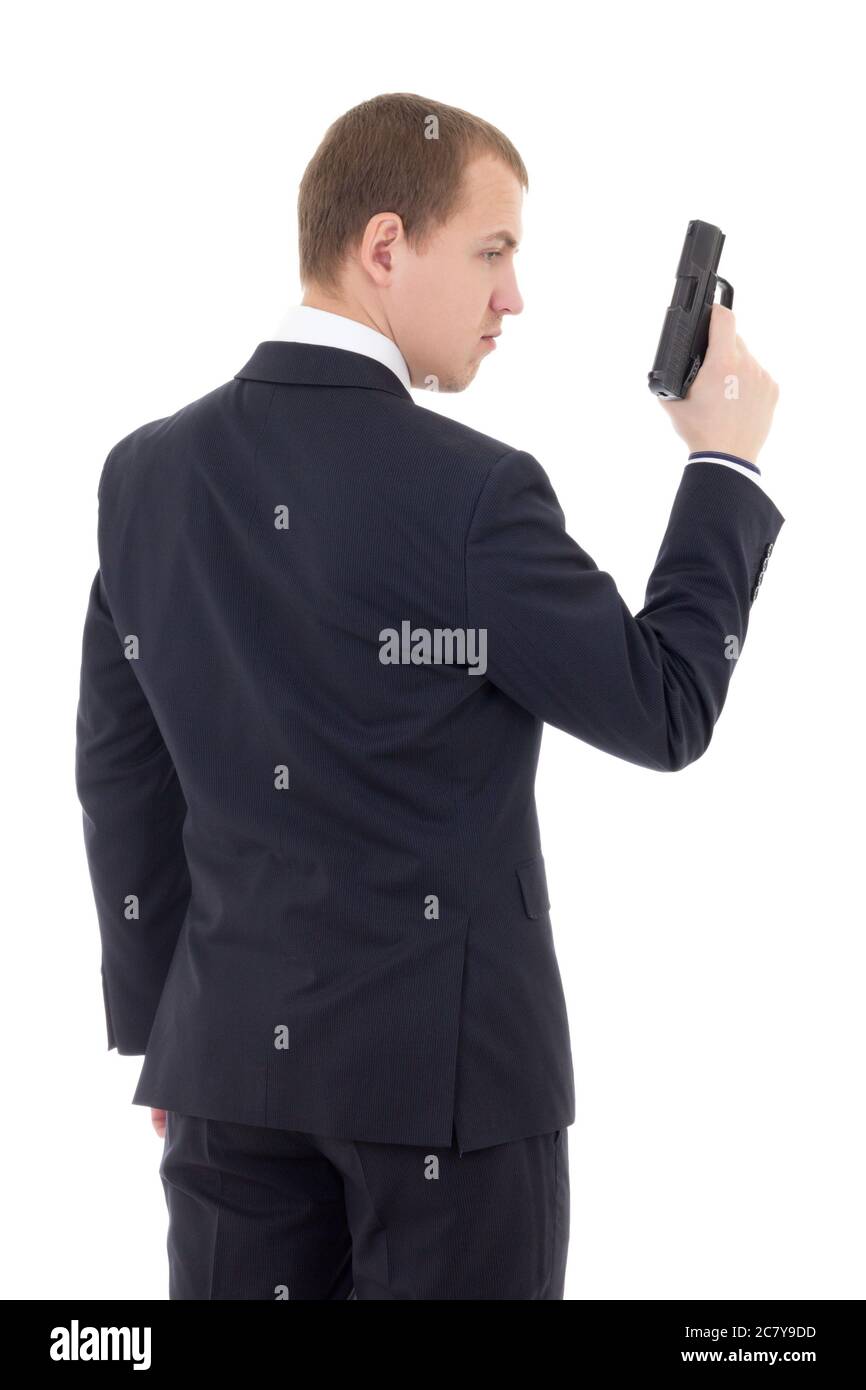 back view of man in business suit with gun isolated on white background ...