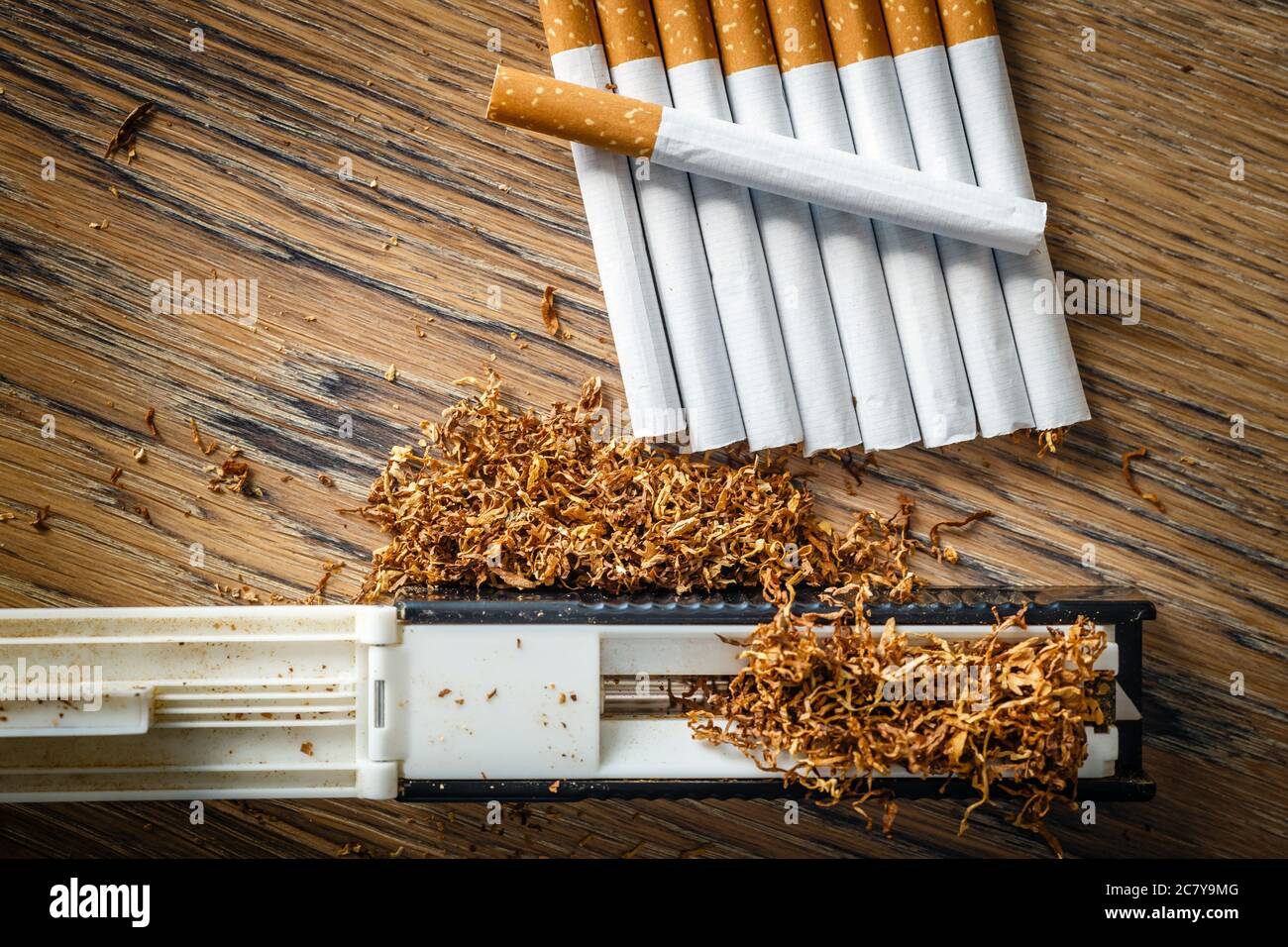 hand-made cigarettes at home using a manual machine Stock Photo - Alamy