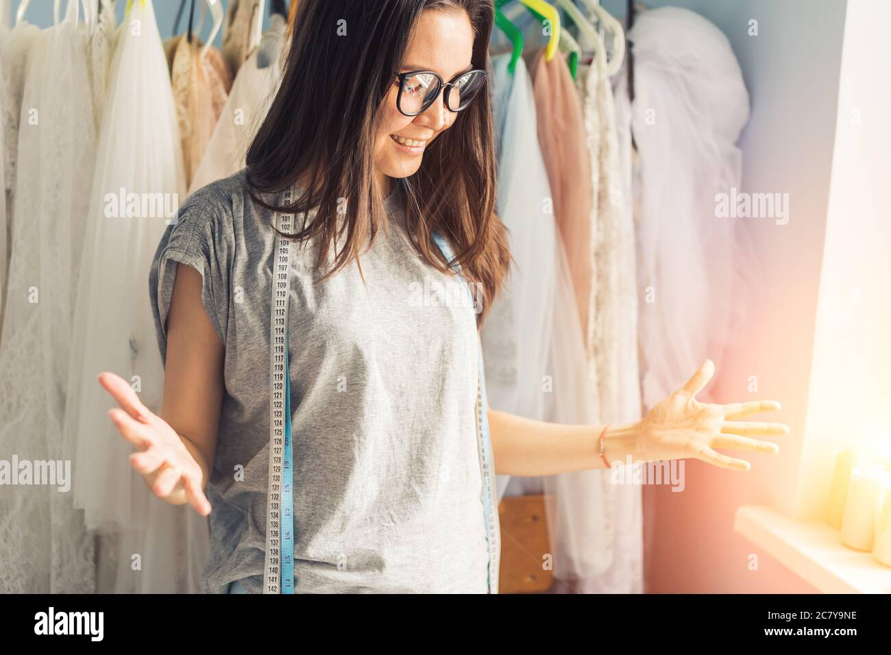 Sewing dress at dressmaker studio Stock Photo - Alamy