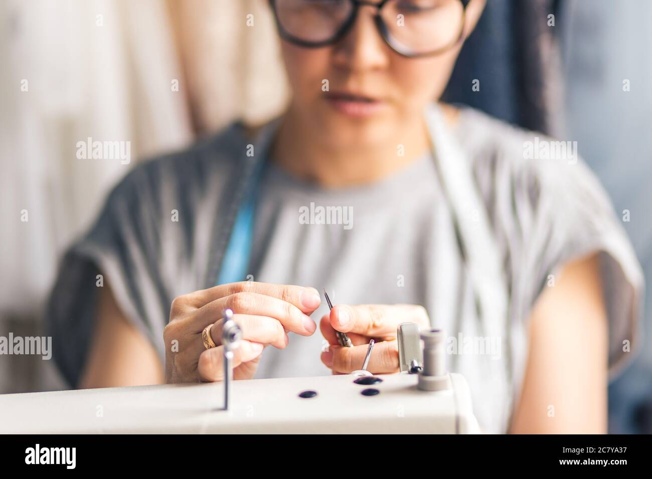 Sewing dress at dressmaker studio Stock Photo - Alamy