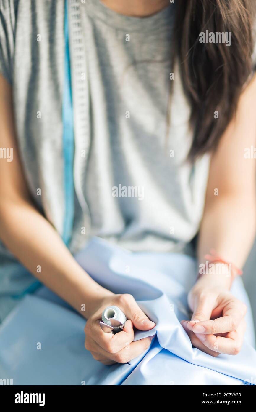 Sewing dress at dressmaker studio Stock Photo - Alamy