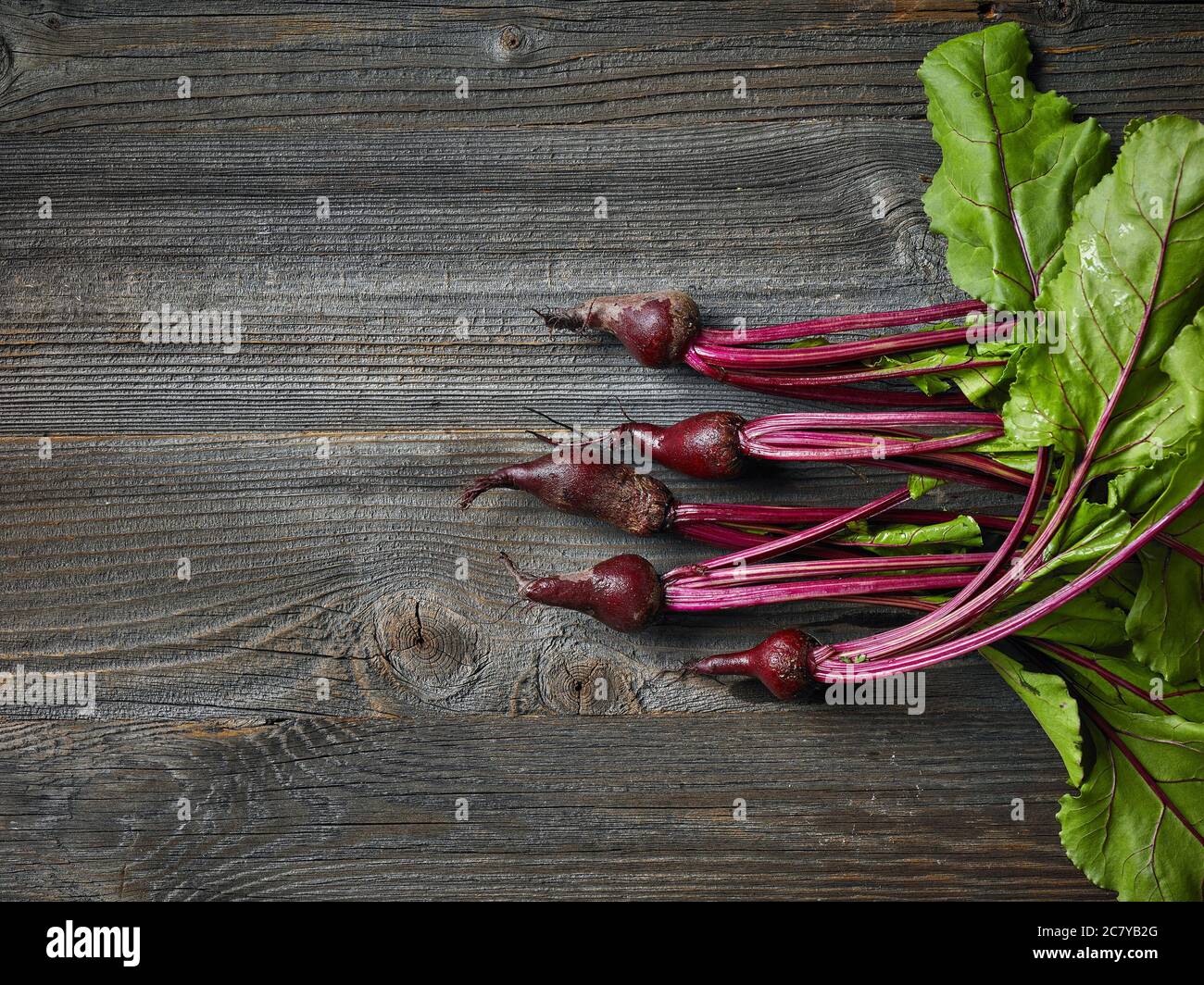 fresh raw beet roots on rustic kitchen table, top view Stock Photo - Alamy