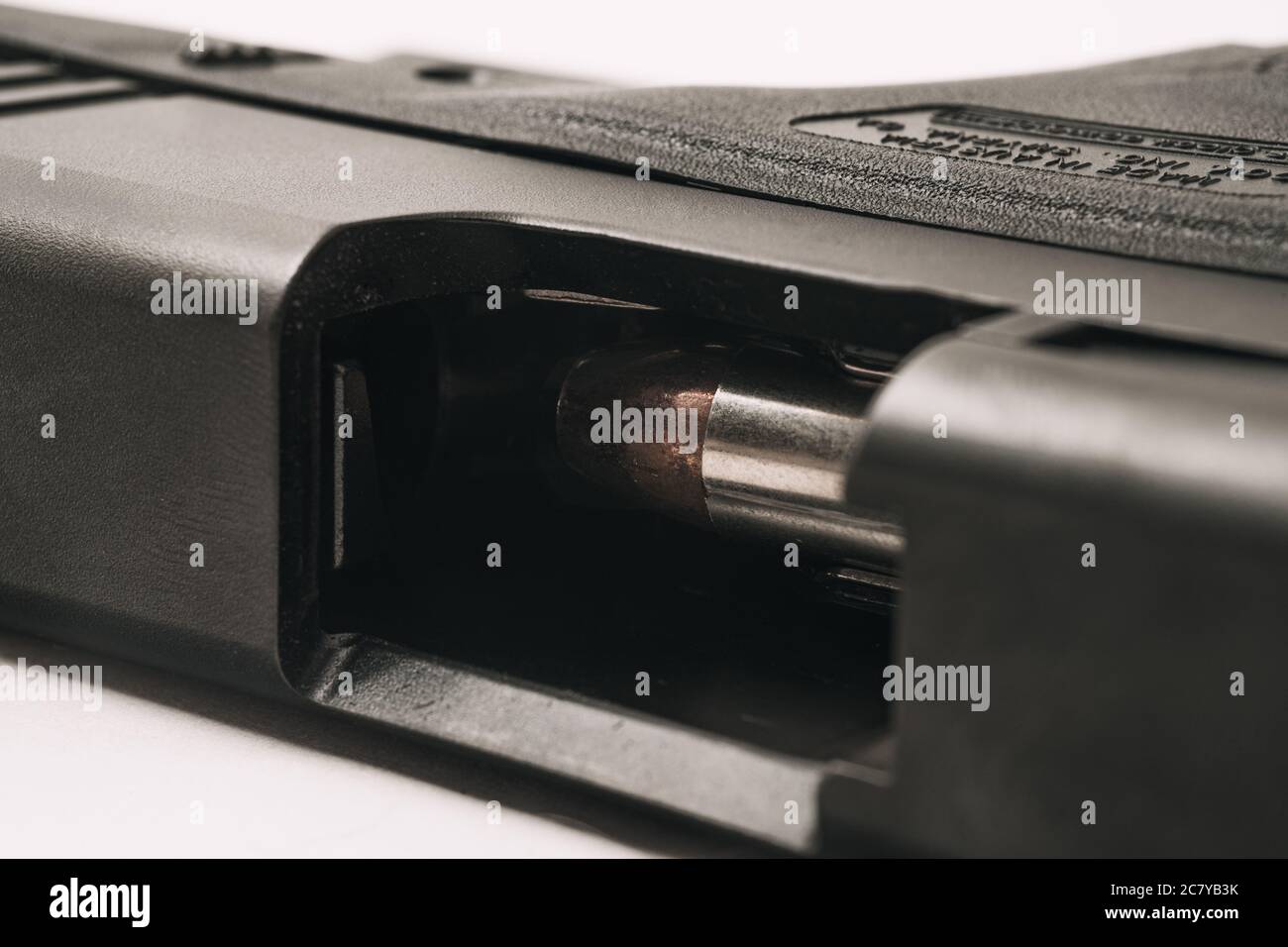 Closeup shot of a 9mm hollow-point bullet seen inside of a pistol Stock ...