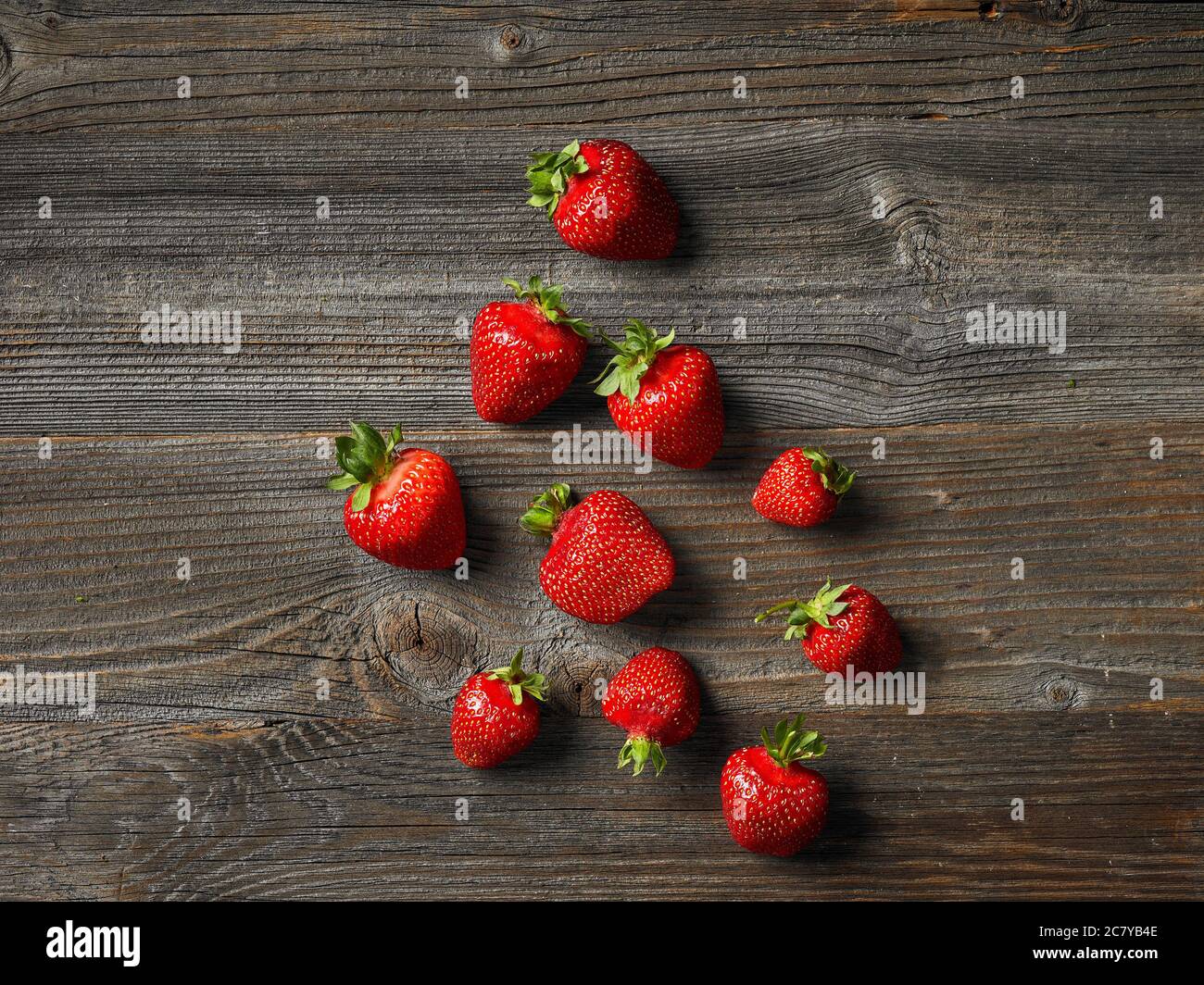 fresh raw strawberries on rustic kitchen table, top view Stock Photo ...