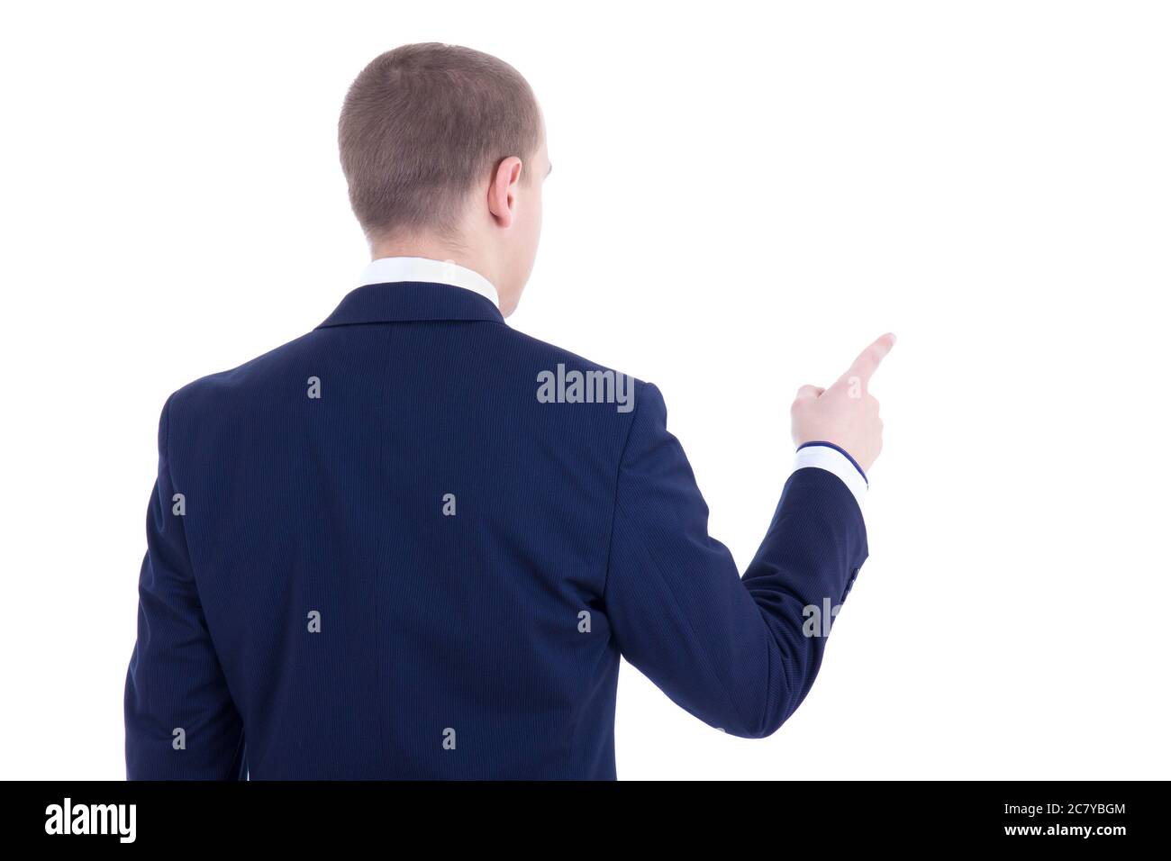 back view of young business man pointing at something isolated on white ...