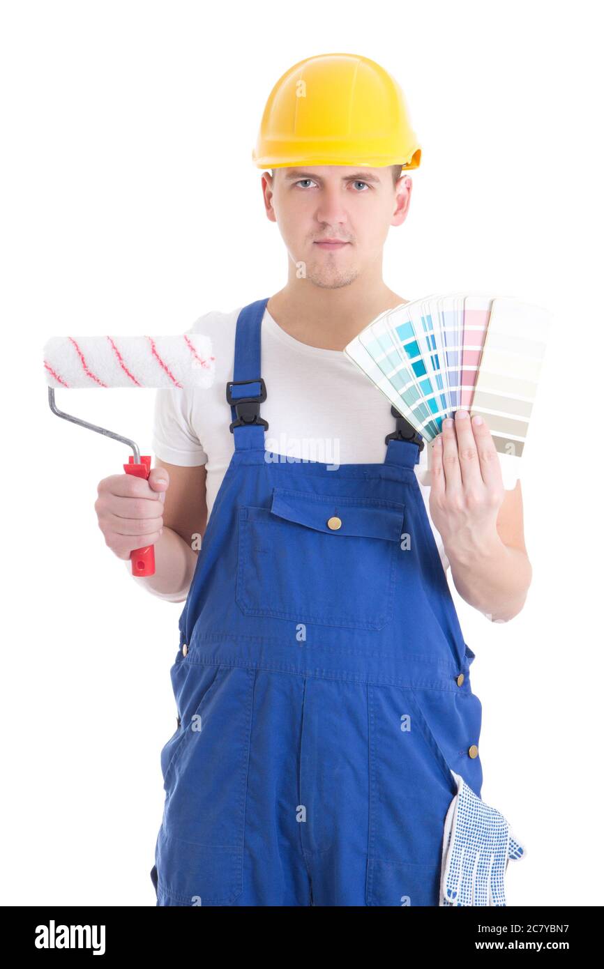 young man painter in workwear with paintbrush and colorful palette ...