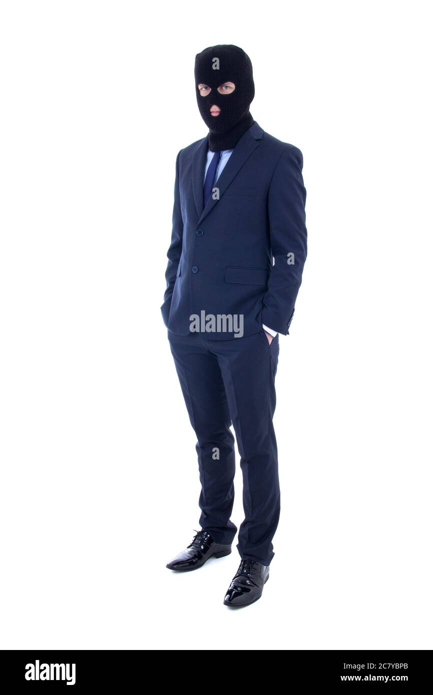 fraud concept - man in business suit and black mask isolated on white ...