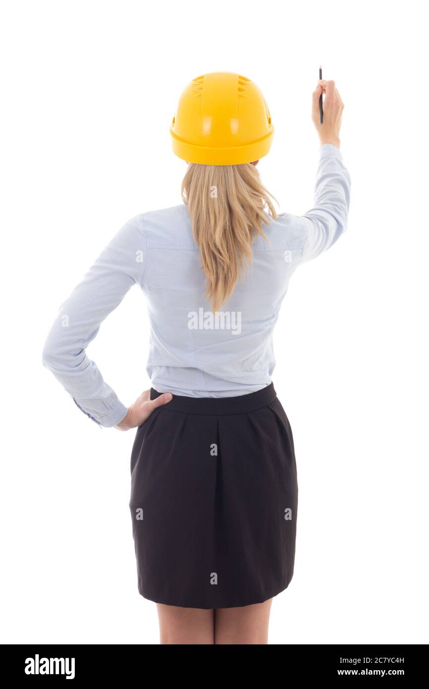 back view of business woman in builder helmet writing something ...