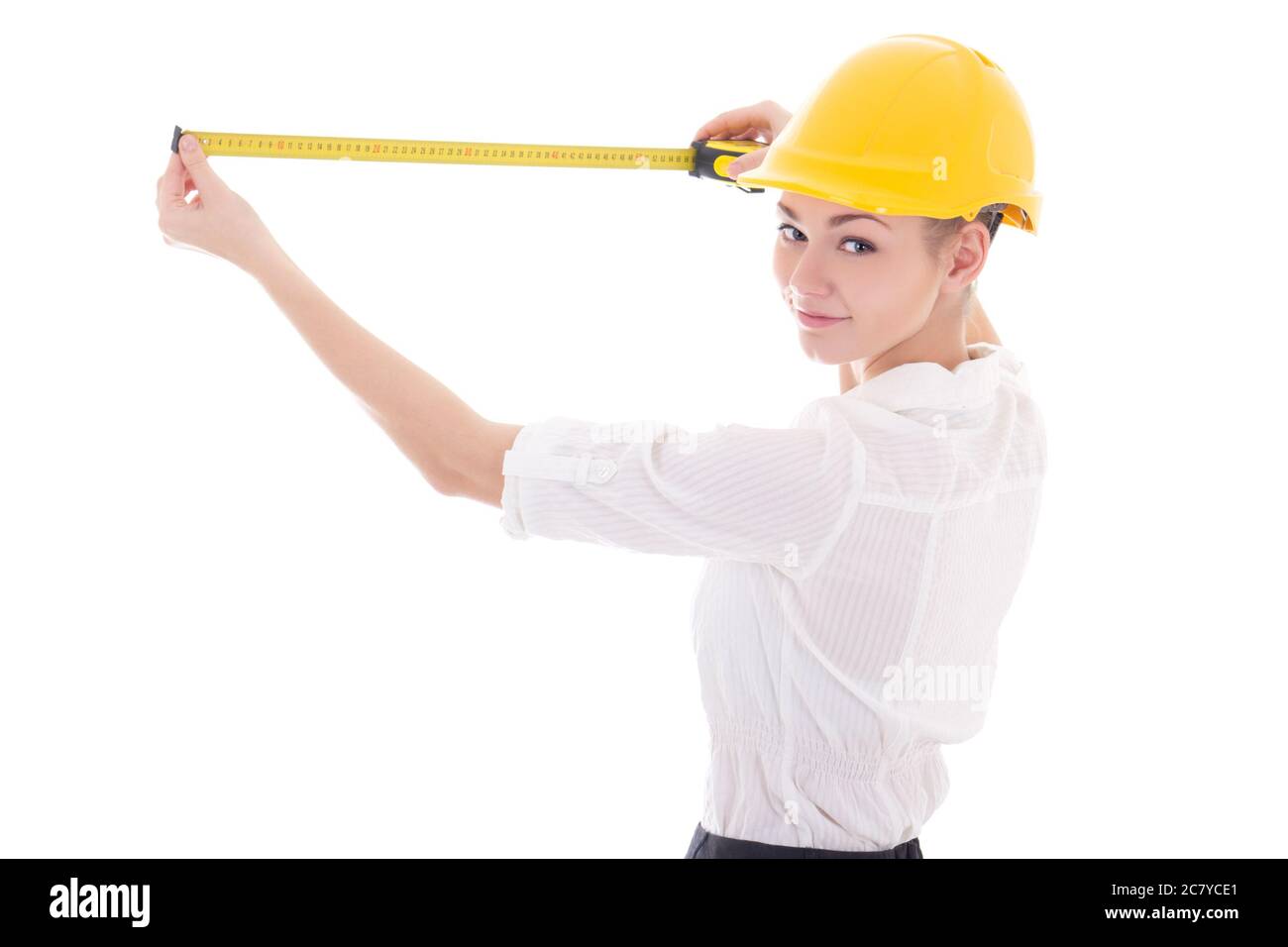business woman architect in yellow builder helmet measuring something ...