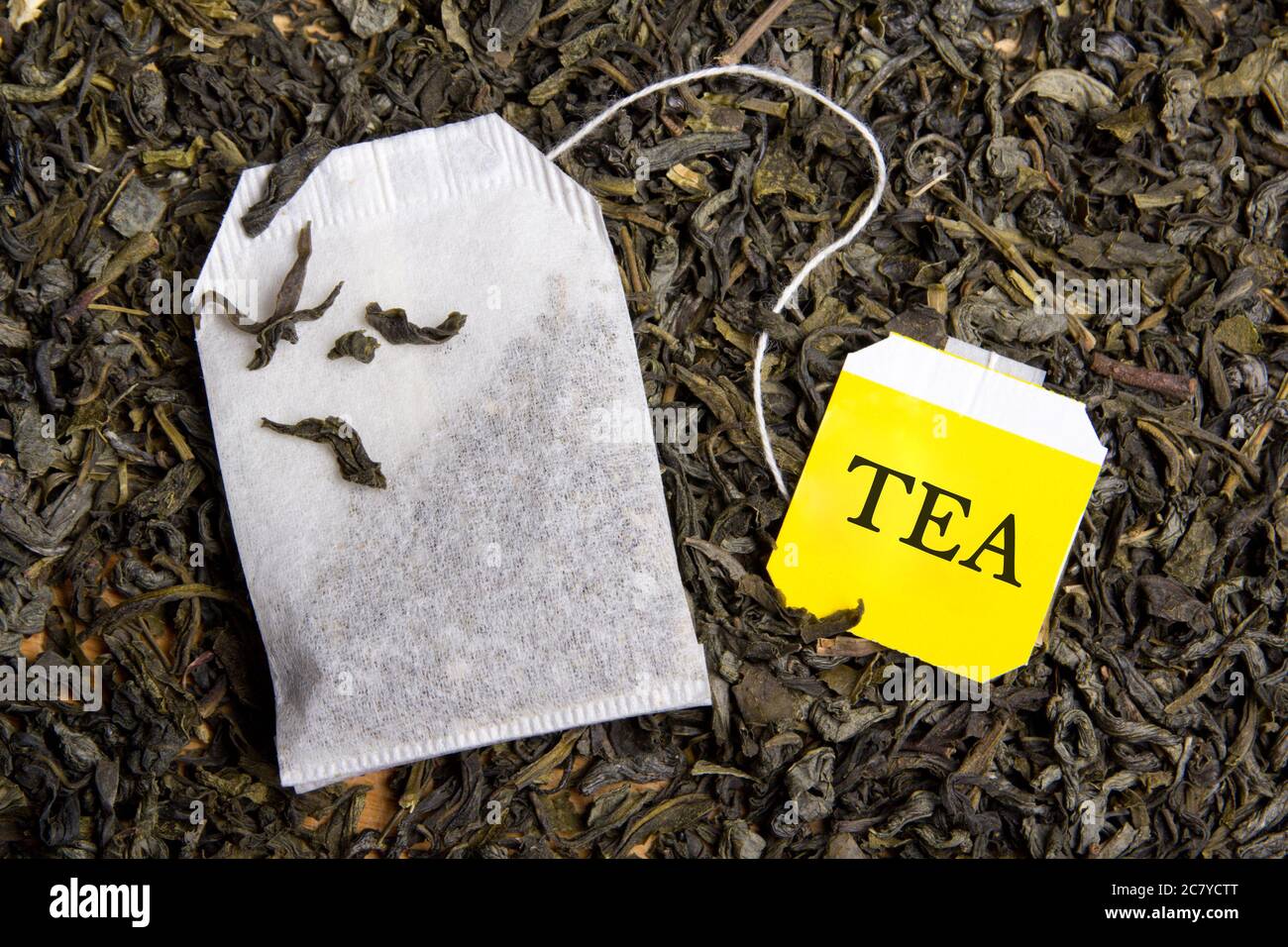 background with dried black tea and paper tea bag Stock Photo - Alamy