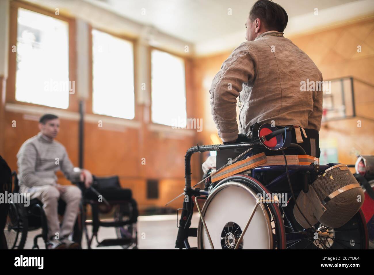 two disabled fencer's masks look at each other Stock Photo - Alamy