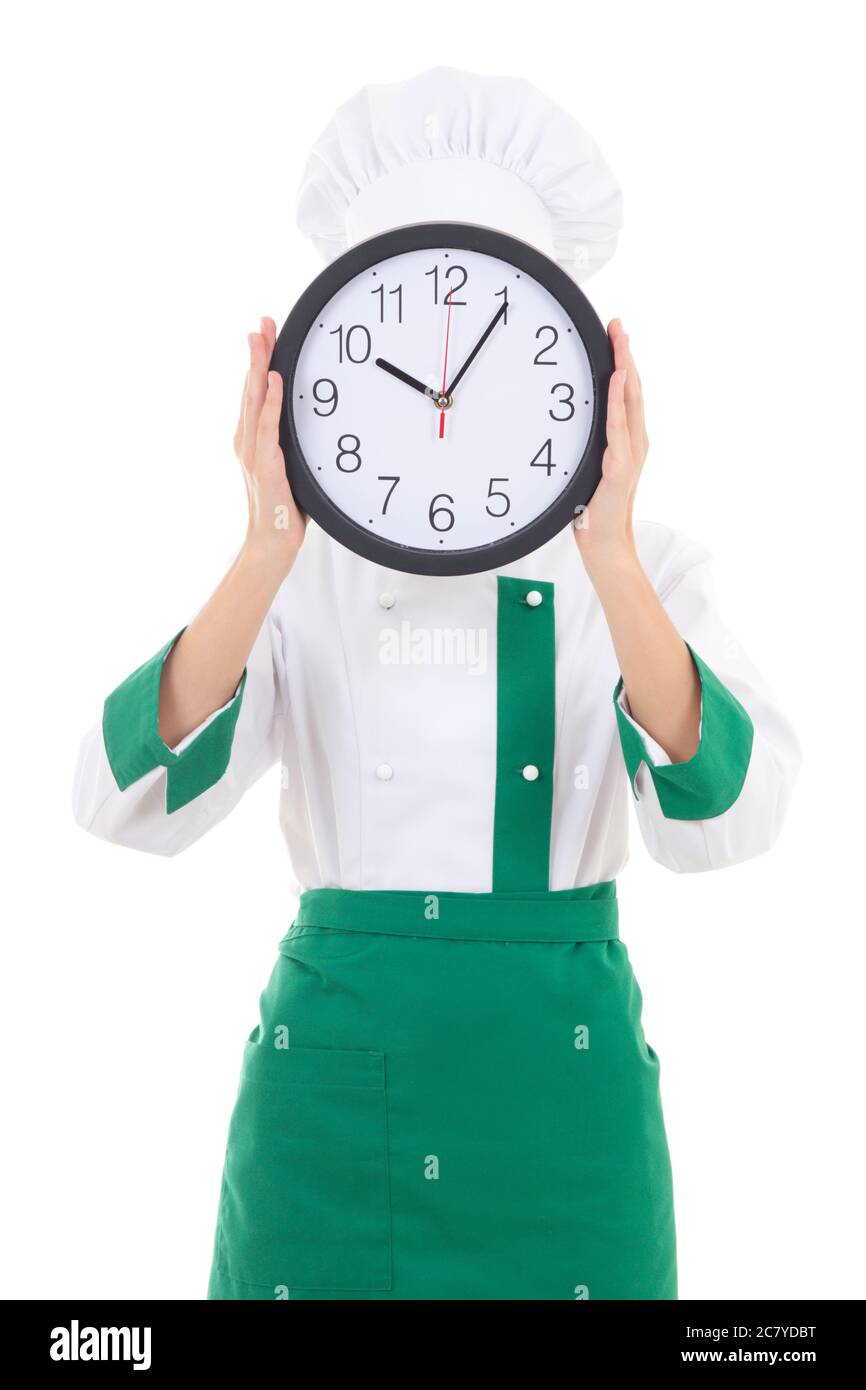 woman chef in uniform holding office clock behind her face isolated on ...