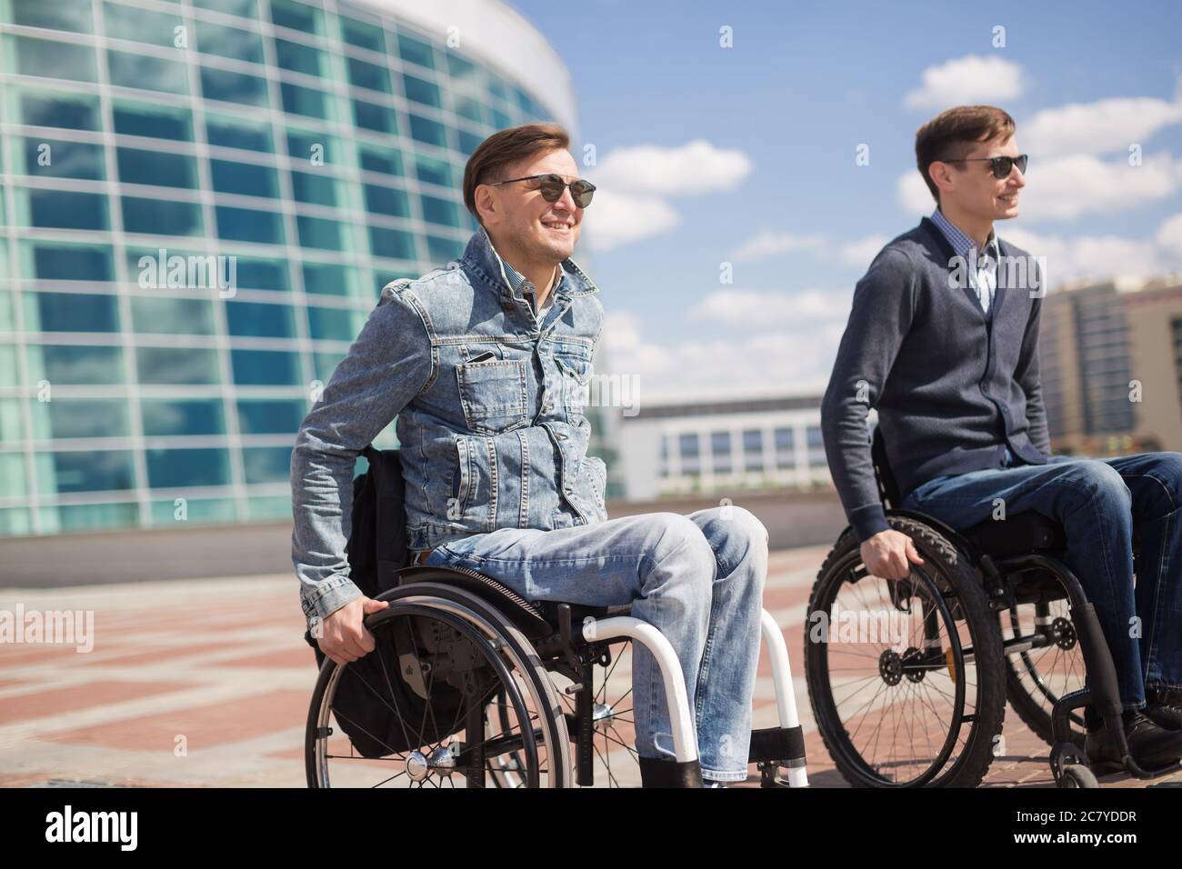 Disabled Happy friends having fun together outside Stock Photo - Alamy