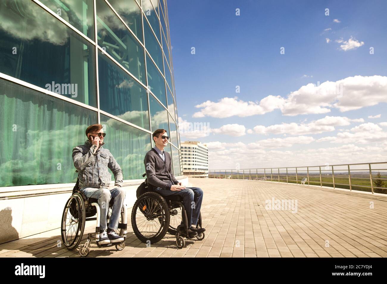 Disabled Happy friends having fun together outside Stock Photo - Alamy
