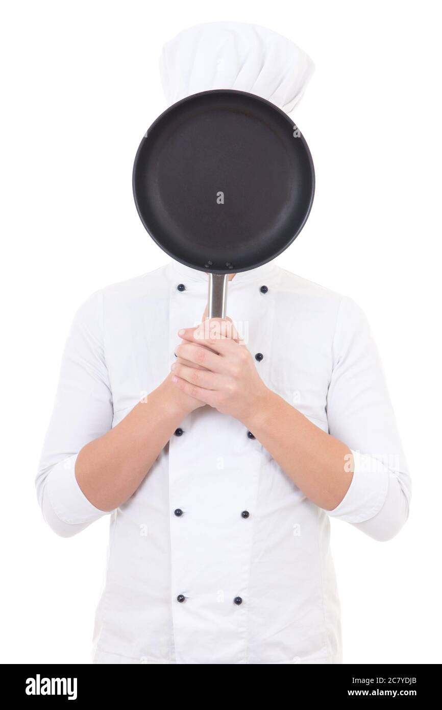 young man in chef uniform with frying pan behind his face isolated on ...