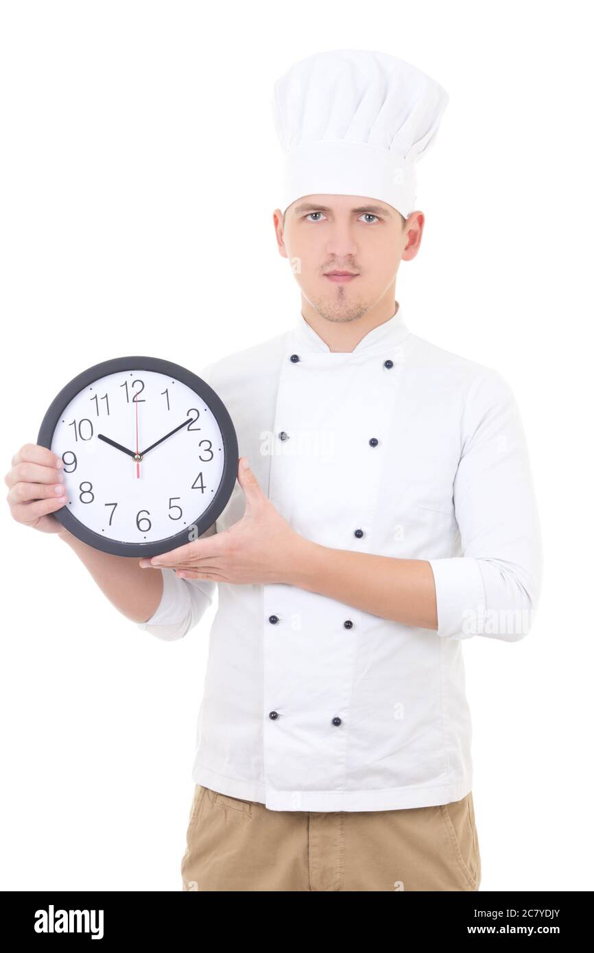 young man chef in uniform showing office clock isolated on white ...