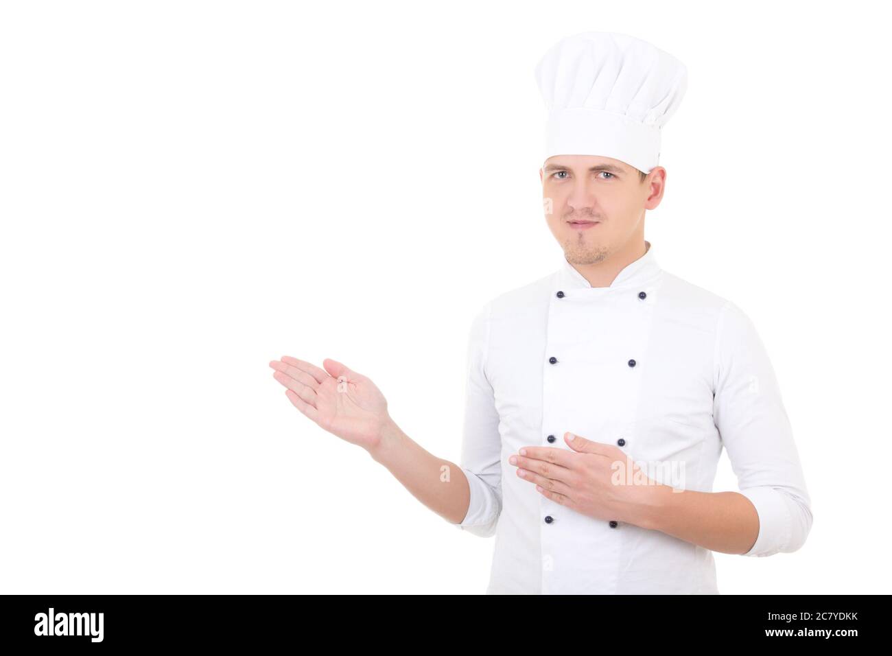 young man chef showing or presenting something isolated on white ...