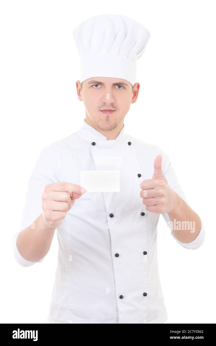 young man chef in uniform thumbs up and showing blank visiting card ...