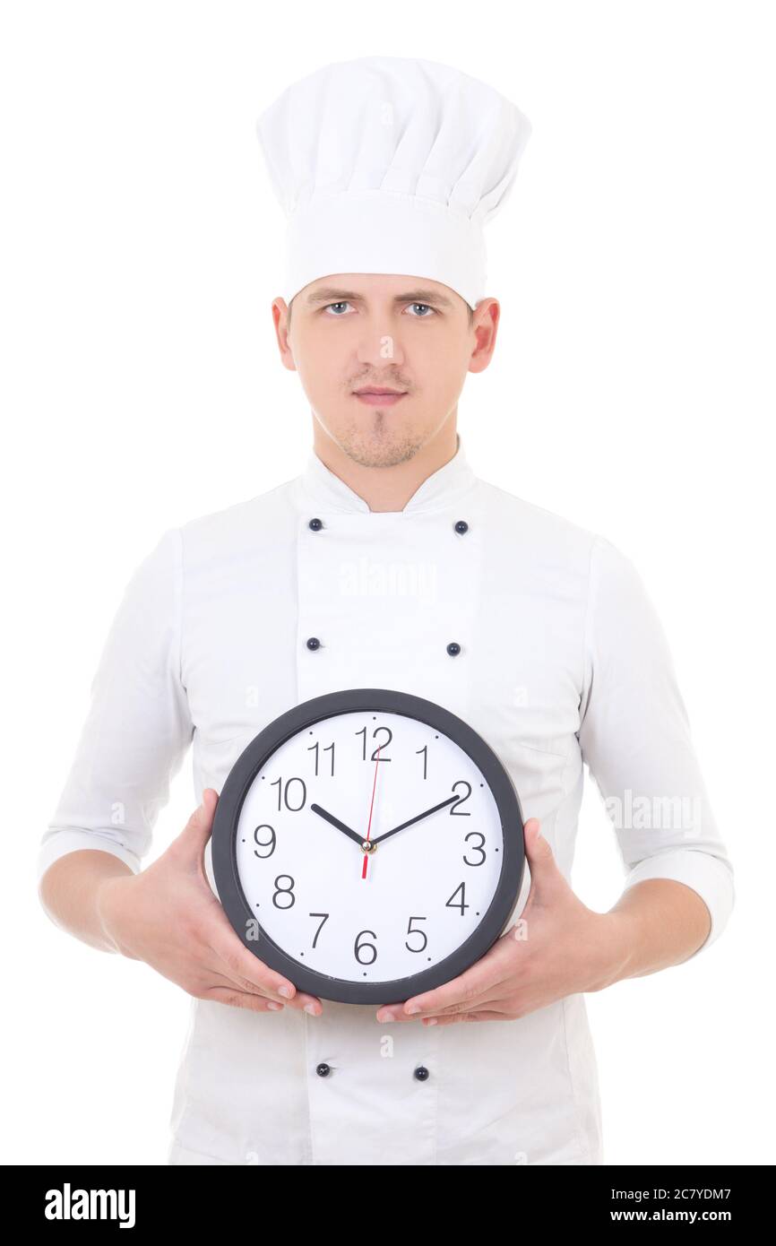 young man chef in uniform holding office clock isolated on white ...