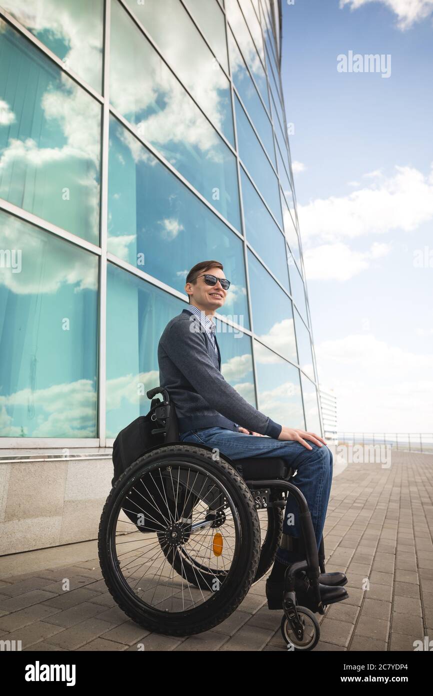 Disabled african guy in wheelchair hi-res stock photography and images ...