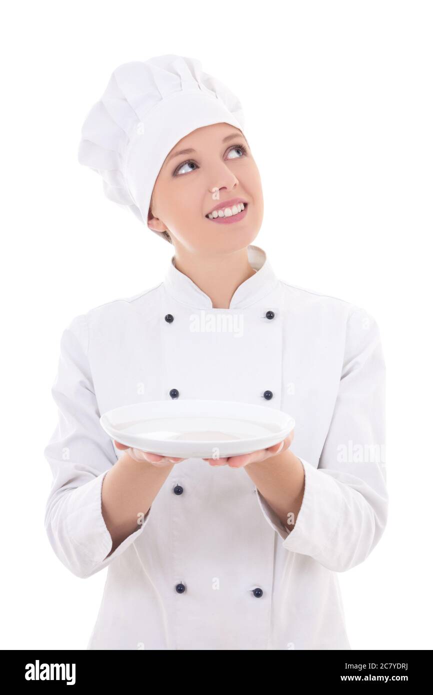 young dreaming woman chef in uniform holding empty plate isolated on ...