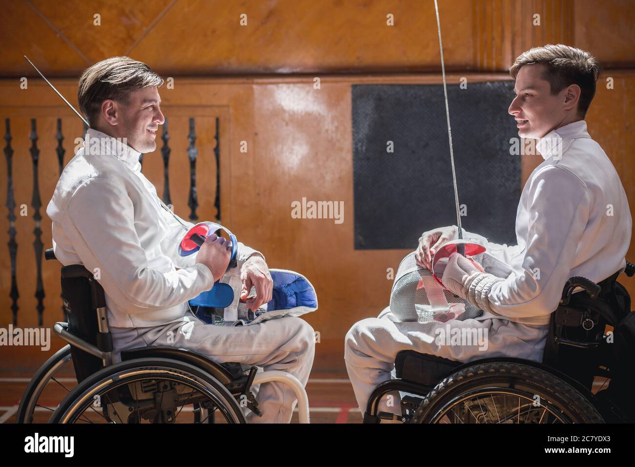 two disabled fencer's masks look at each other Stock Photo - Alamy