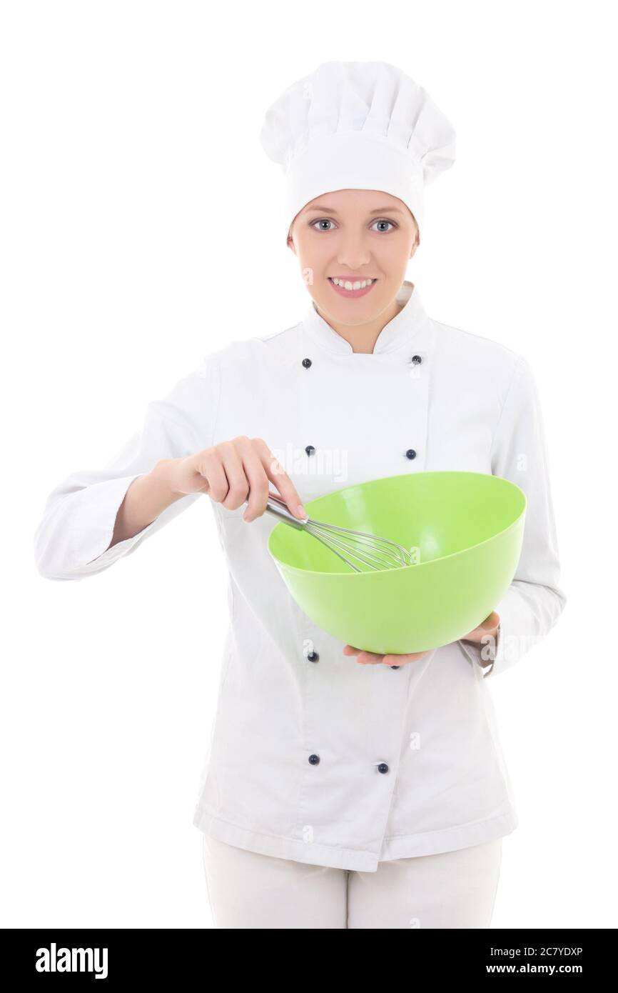 young woman in chef uniform mixing something in green plastic bowl ...