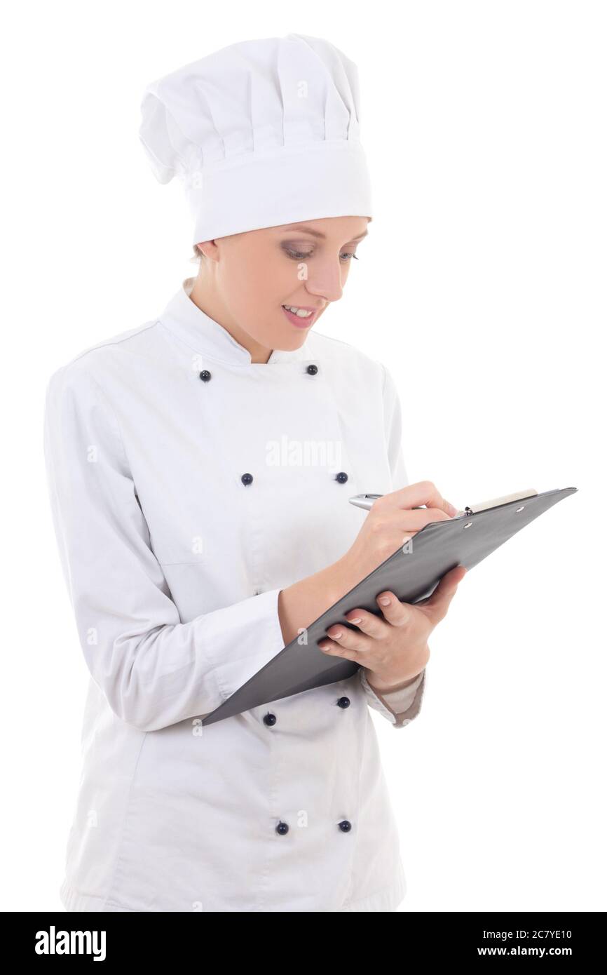 young woman in chef uniform writing something in clipboard isolated on ...