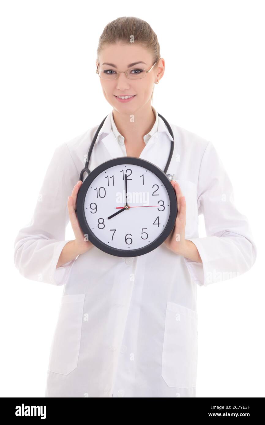 happy young female doctor holding office clock isolated on white ...