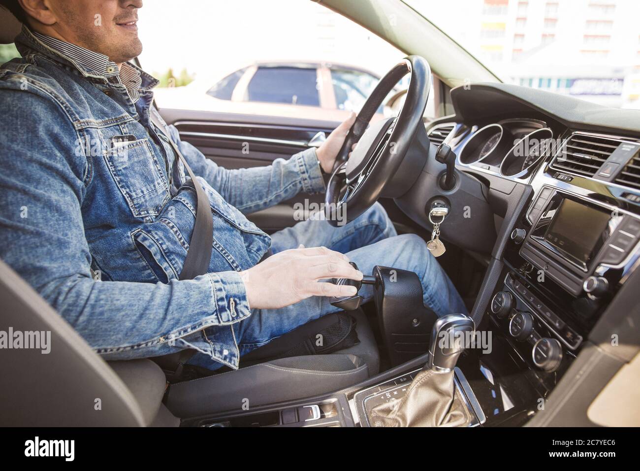 Elder disabled person driving a special car Stock Photo - Alamy