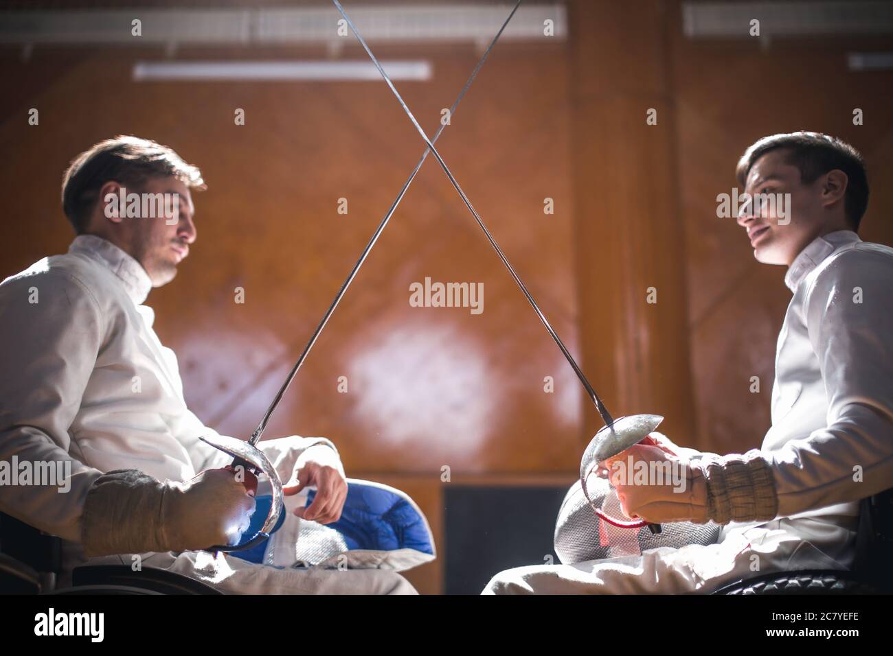 two disabled fencer hold rapier collided head-on Stock Photo - Alamy
