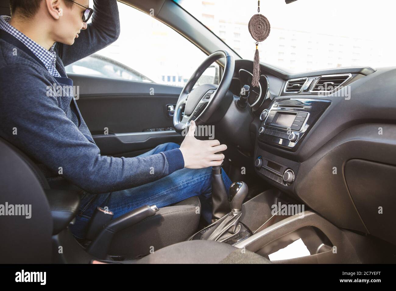 Elder disabled person driving a special car Stock Photo - Alamy