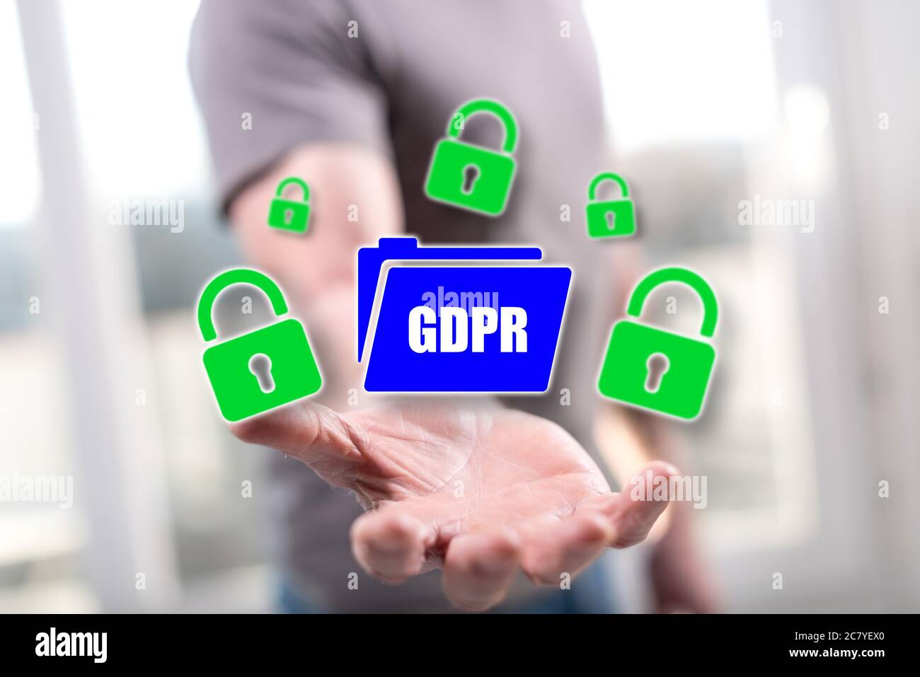 Gdpr concept above the hand of a man in background Stock Photo - Alamy
