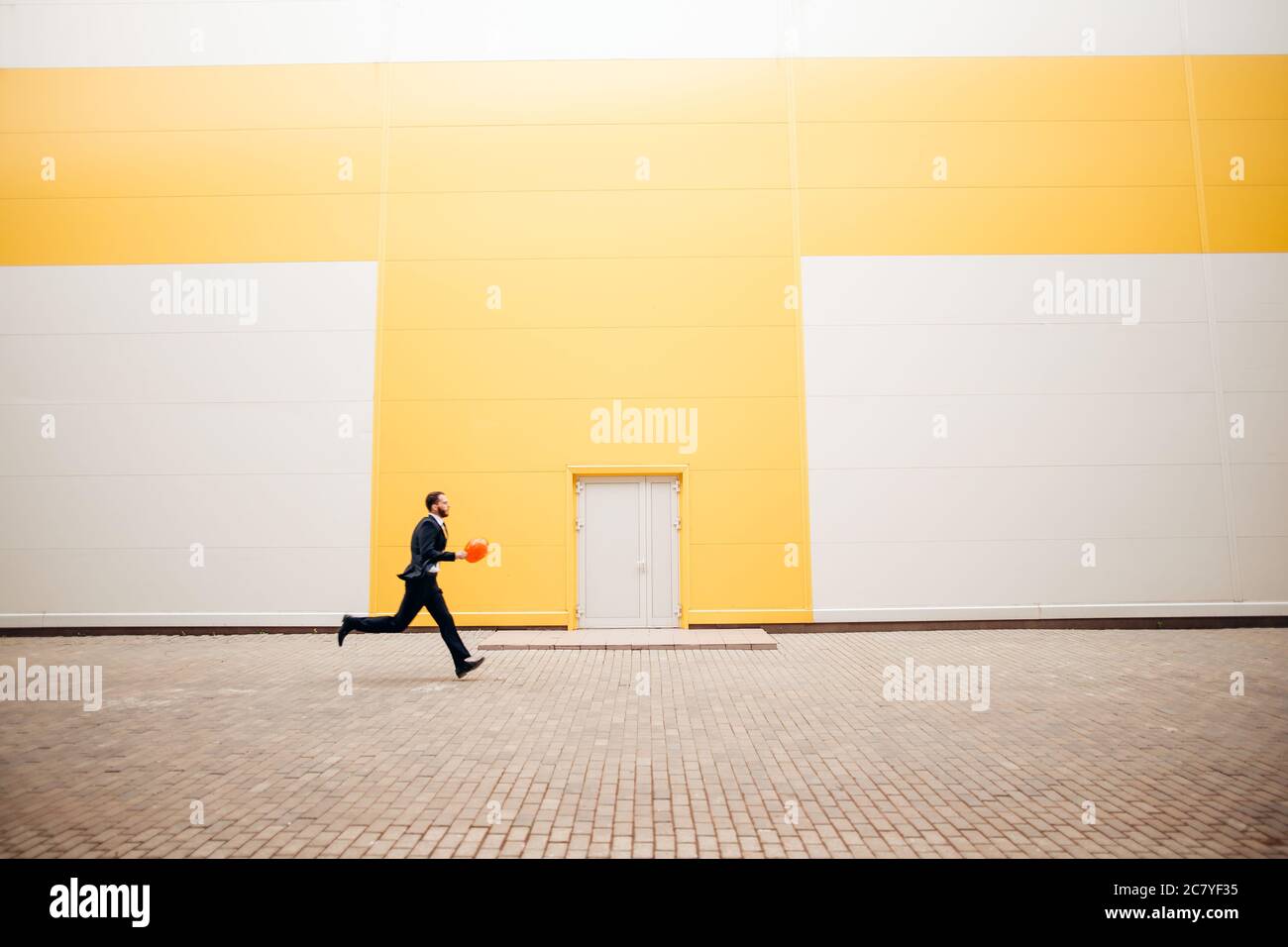 Construction worker running from danger on construction site Stock ...