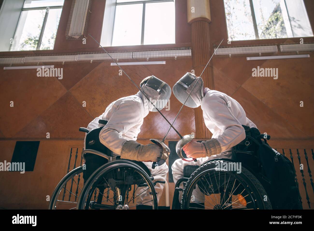 two disabled fencer hold rapier collided head-on Stock Photo - Alamy