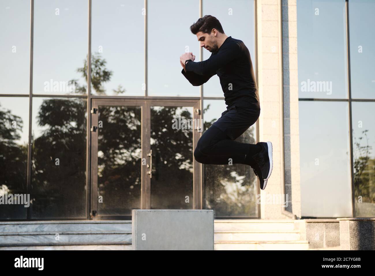 Strong handsome sportsman jumping hi-res stock photography and images ...