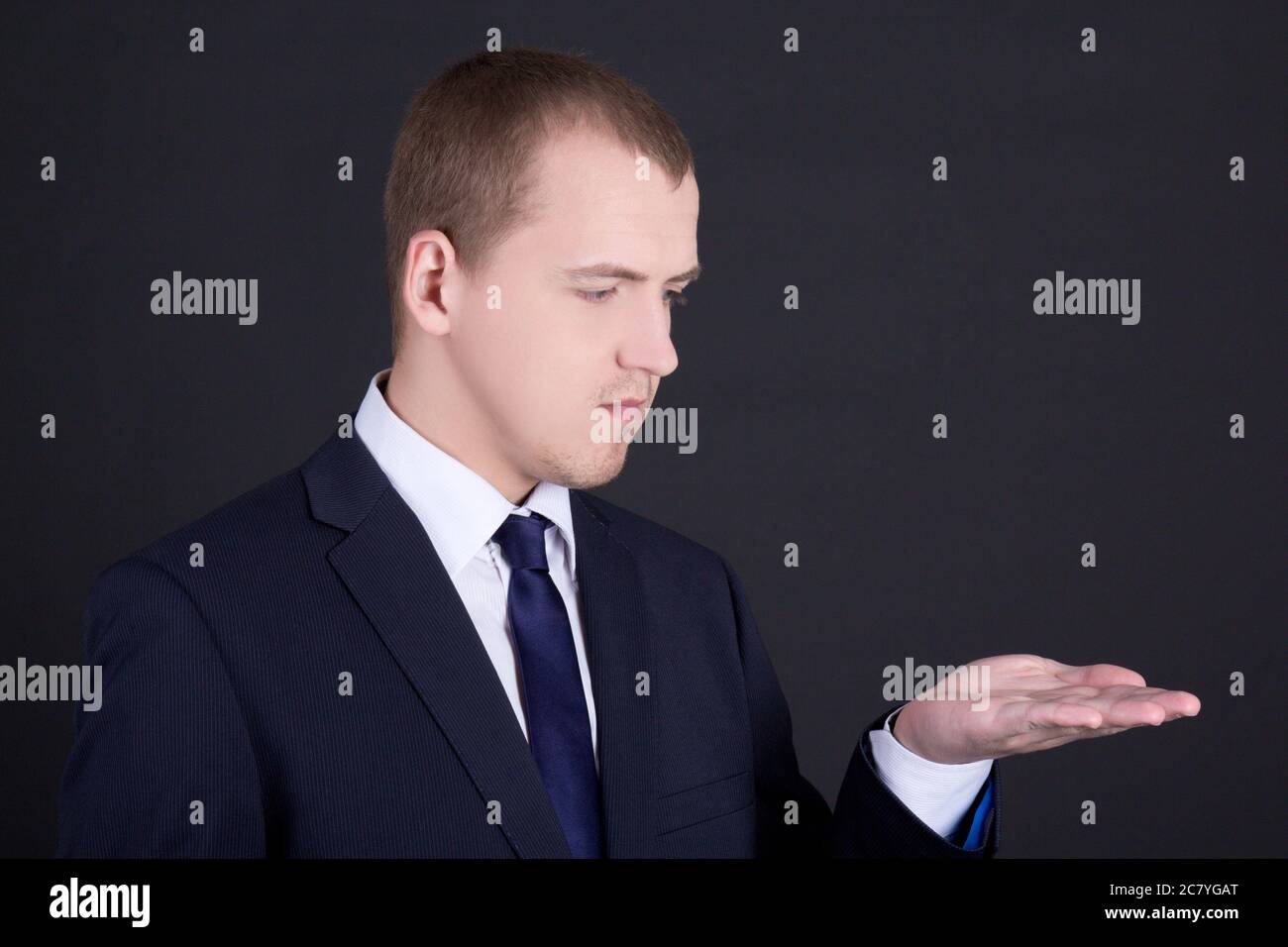 Isolated Young Man Giving Something High Resolution Stock Photography ...