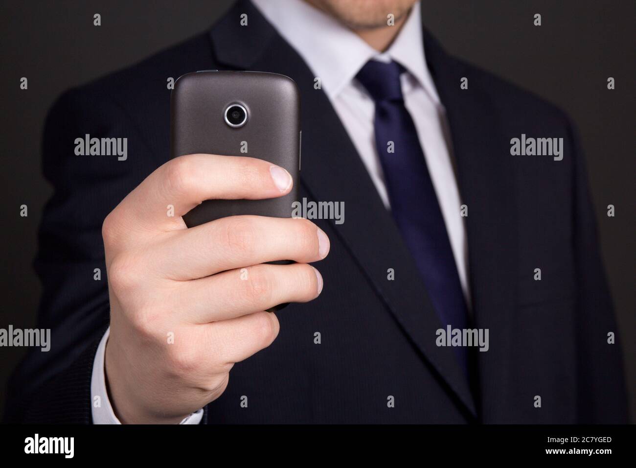 modern mobile phone with camera in business man hand Stock Photo - Alamy