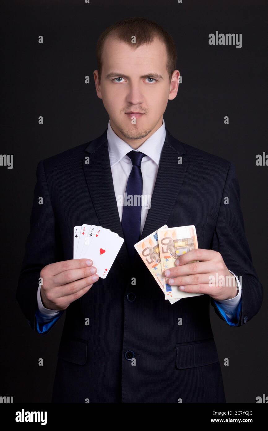 Businessman showing playing card hi-res stock photography and images ...