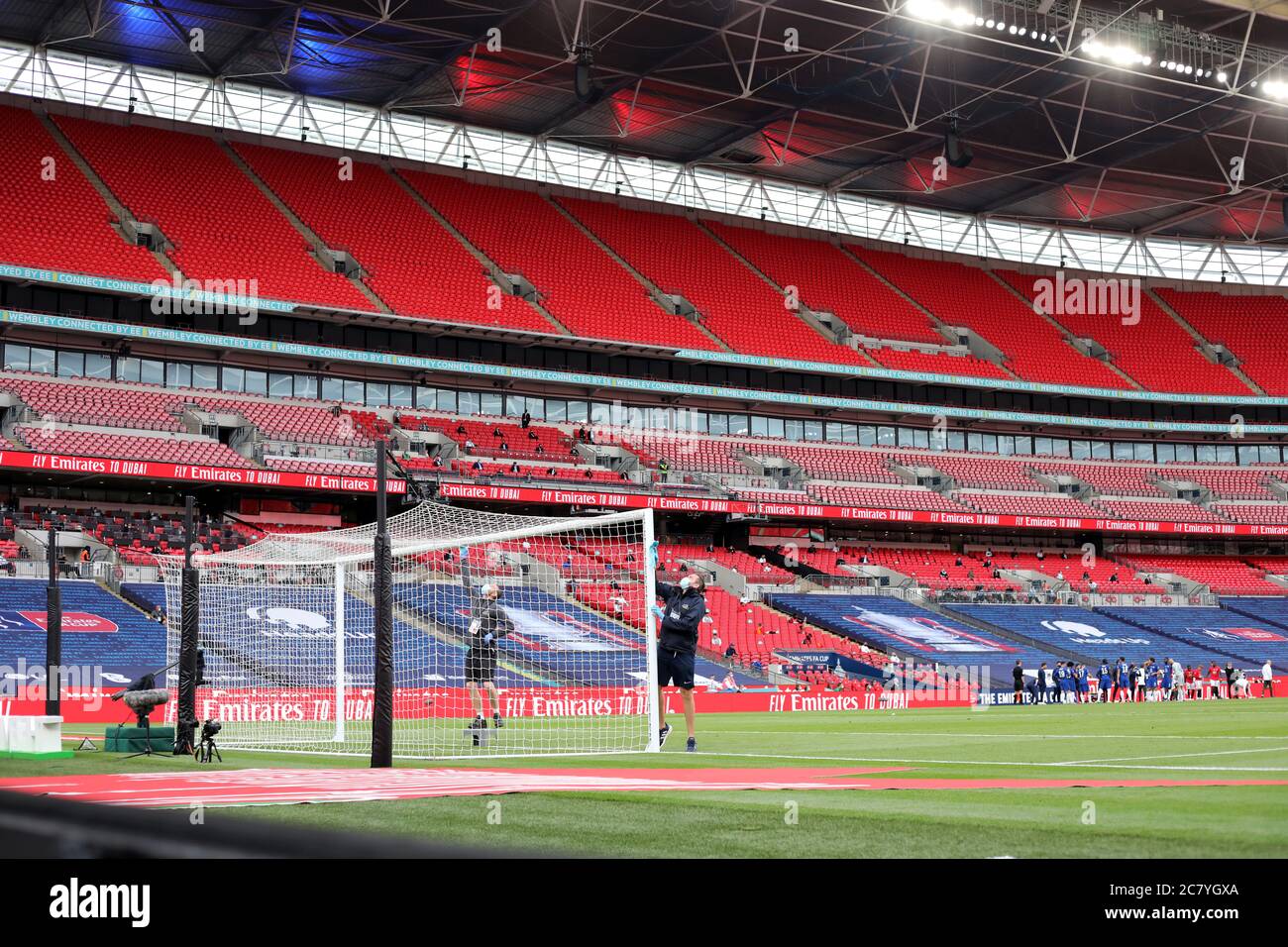 Wembley, UK. 19th July, 2020. Staff cleaning the goalposts during the ...