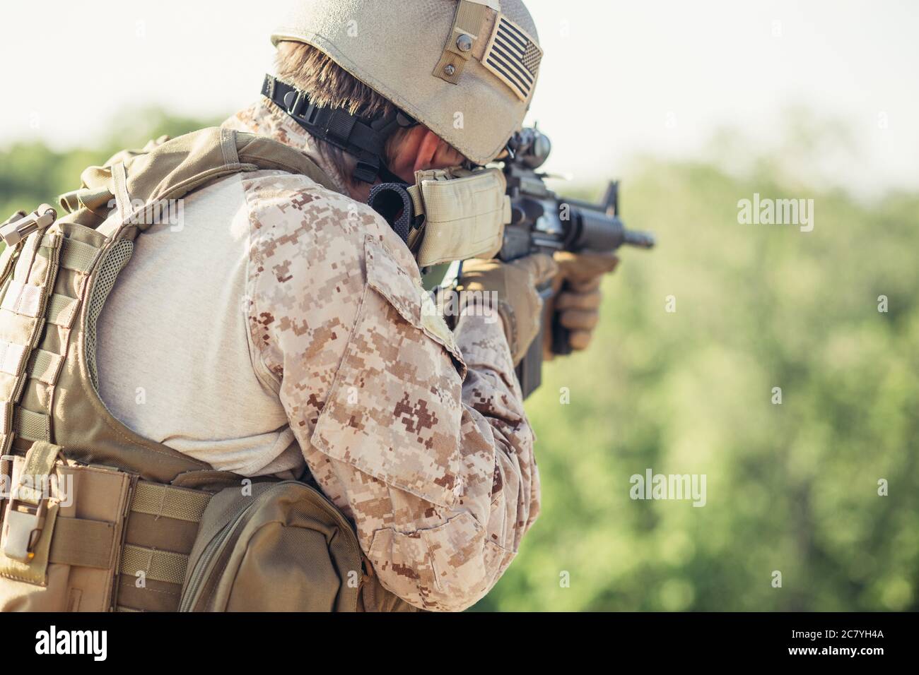 Army soldier in Protective Combat Uniform holding Special Operations ...