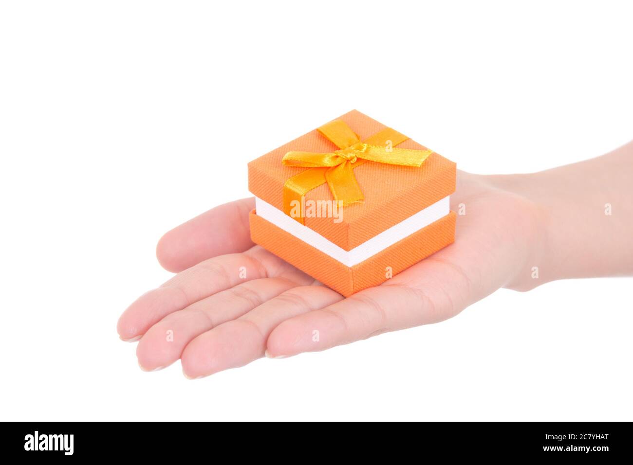 small orange gift box in woman hand isolated on white background Stock ...