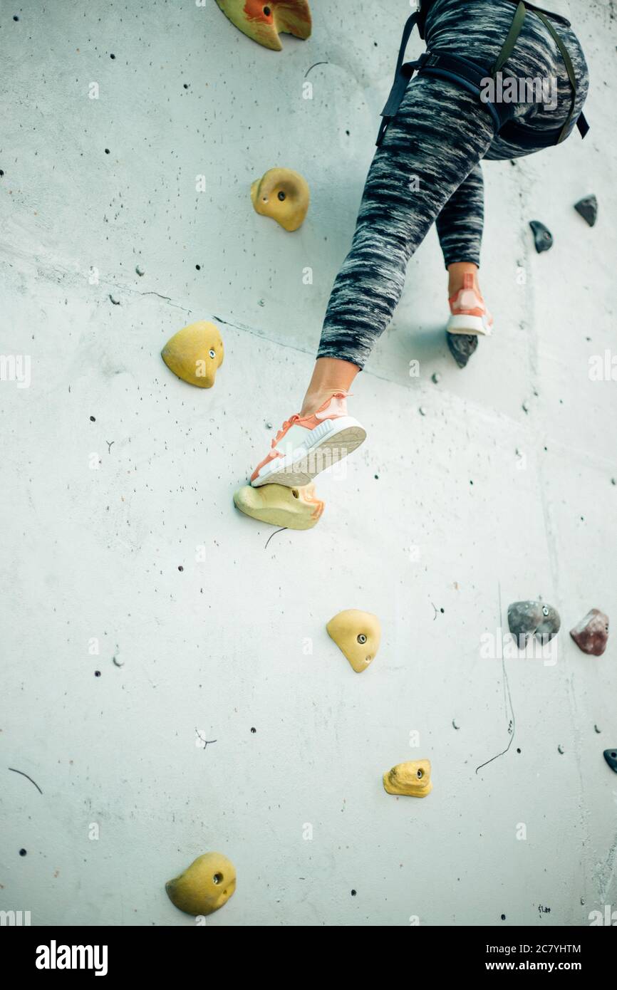 Close-up image of female foot on climbing wall Stock Photo - Alamy