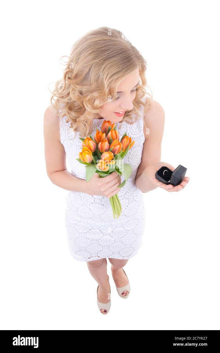 proposal concept - surprised woman with tulips and little gift box with ...