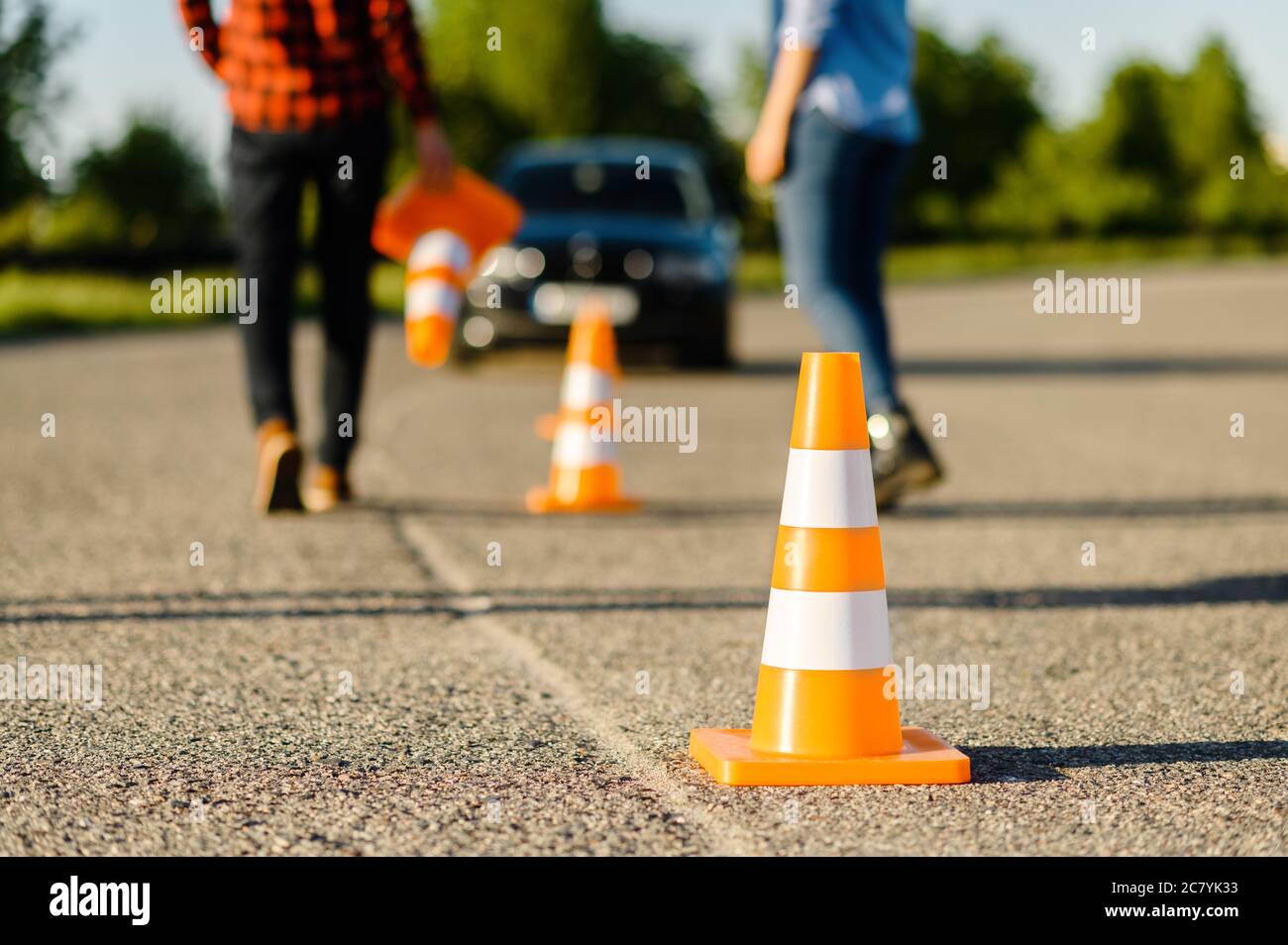 Instructor and student on road with traffic cones Stock Photo - Alamy