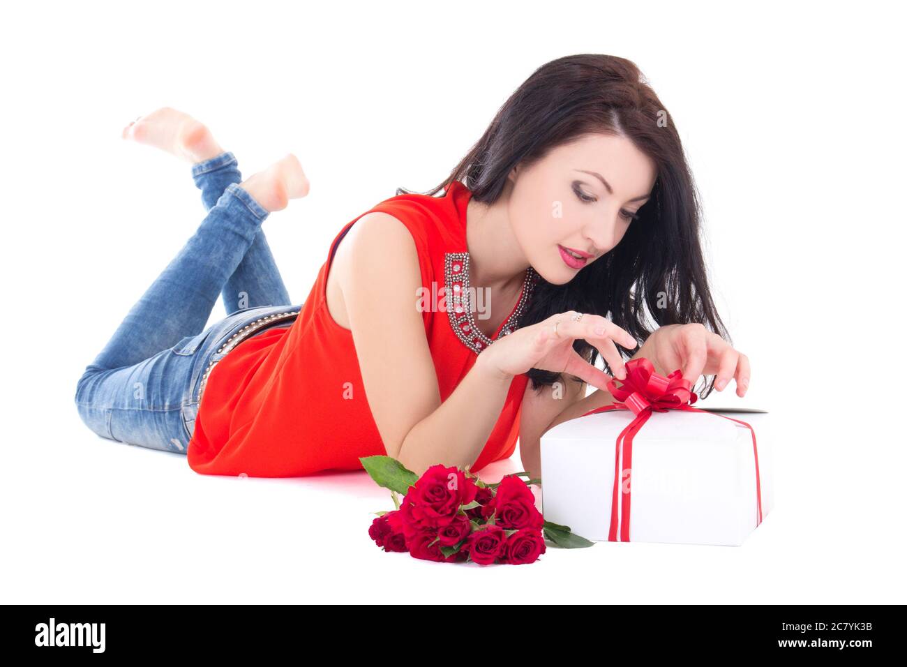 young beautiful woman opening gift box isolated on white background ...